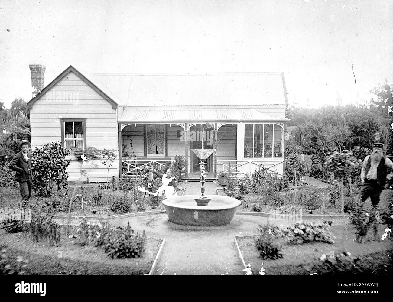 Negative - Victoria, circa 1900, Two men and a woman in a formal garden ...