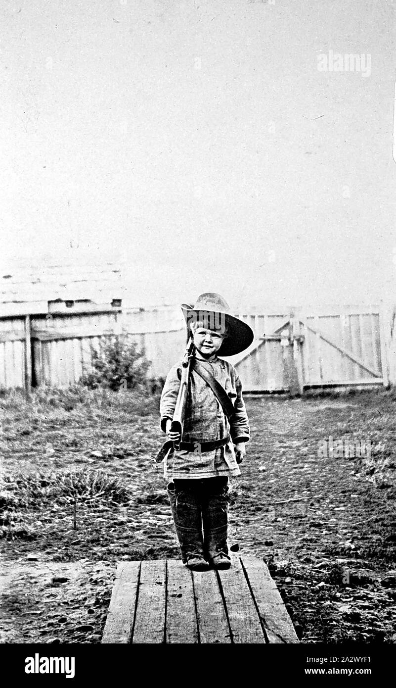 Negative - Victoria, circa 1920, A small boy dressed in his father's ...