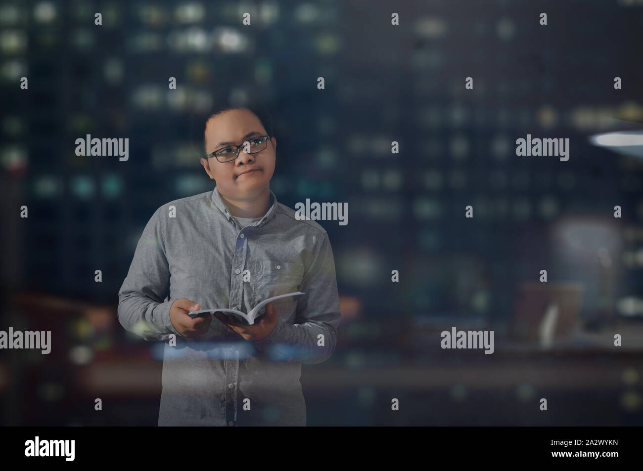 Young business man temporarily looking at something else and thinking ...