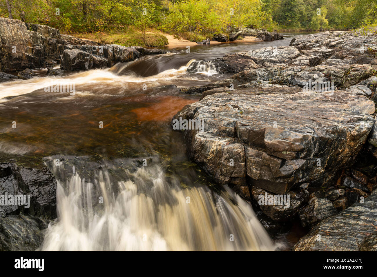 Eau Claire River Waterfall In Autumn Stock Photo - Alamy
