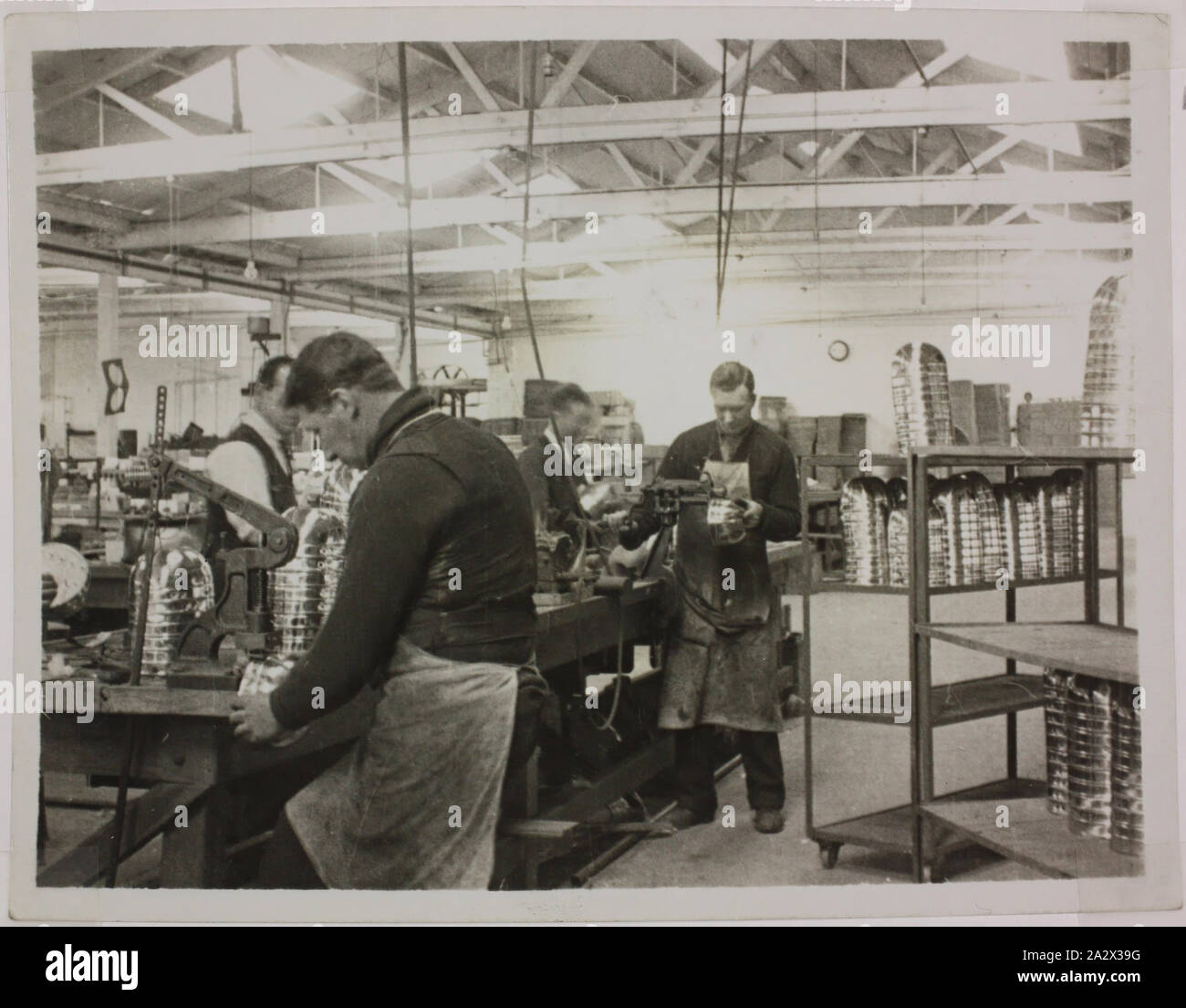 Factory workers assembling auto safety kettles hi-res stock photography ...