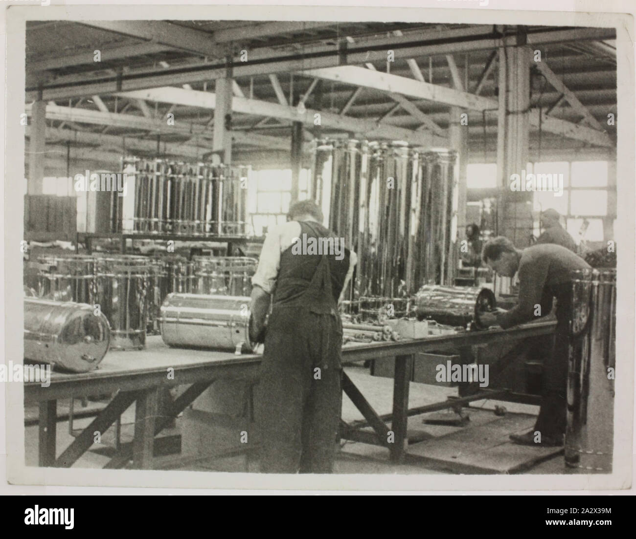 Hecla employees assembling water cylinders hi-res stock photography and ...