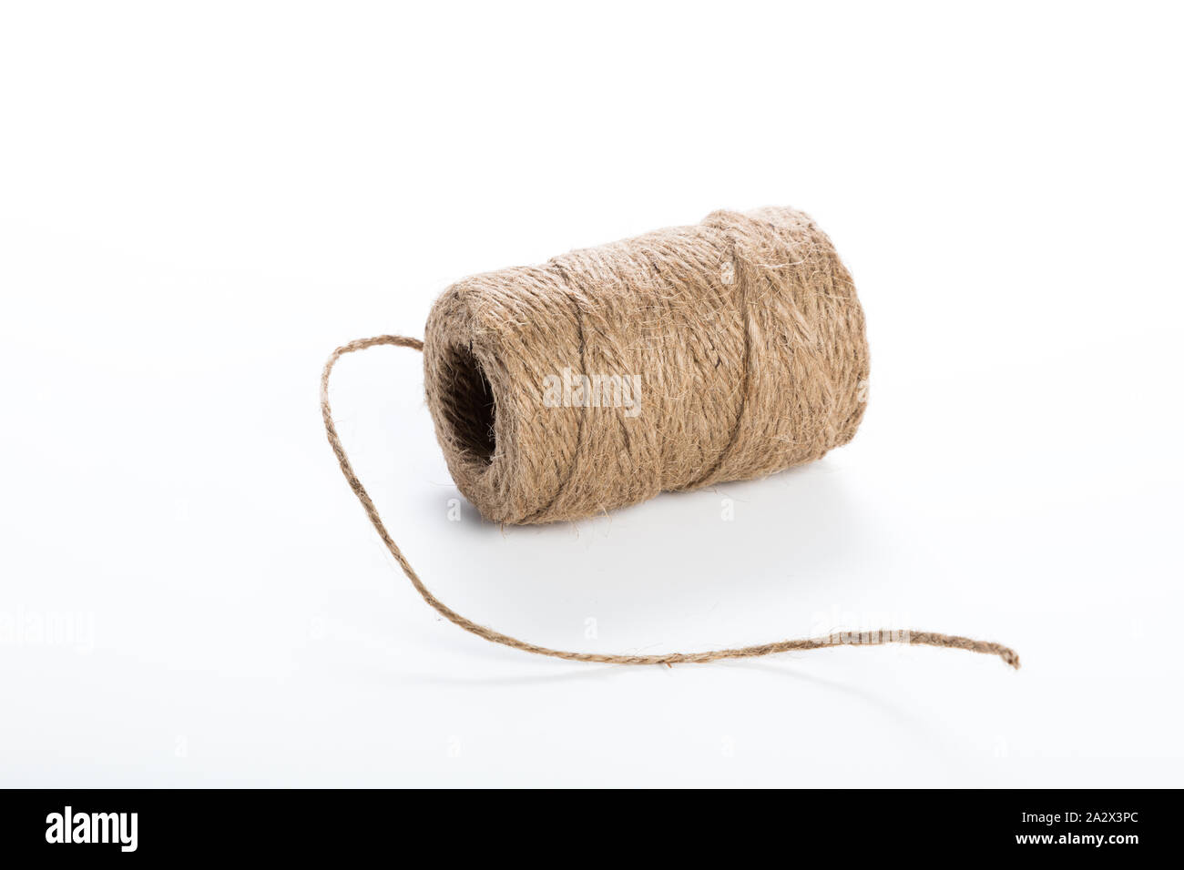 Roll of sisal rope isolated on white background Stock Photo - Alamy