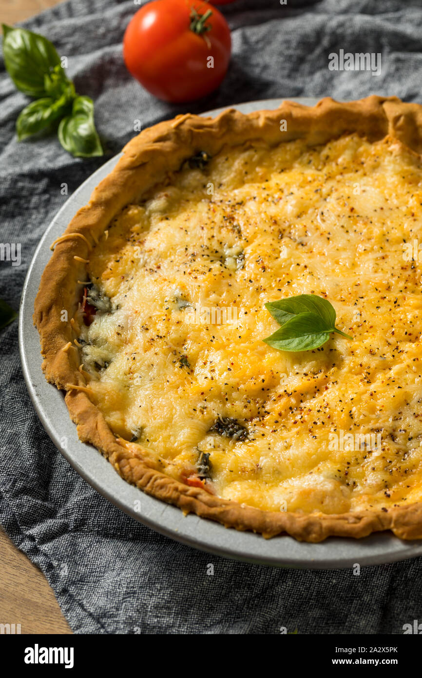 Homemade Cheesy Tomato Pie with Basil and Herbs Stock Photo - Alamy