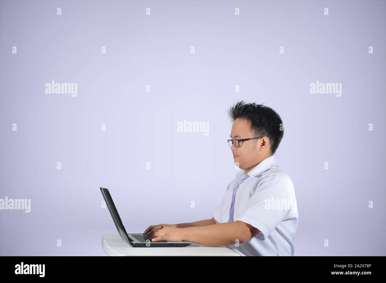 School boy computer teenager uniform hi-res stock photography and ...