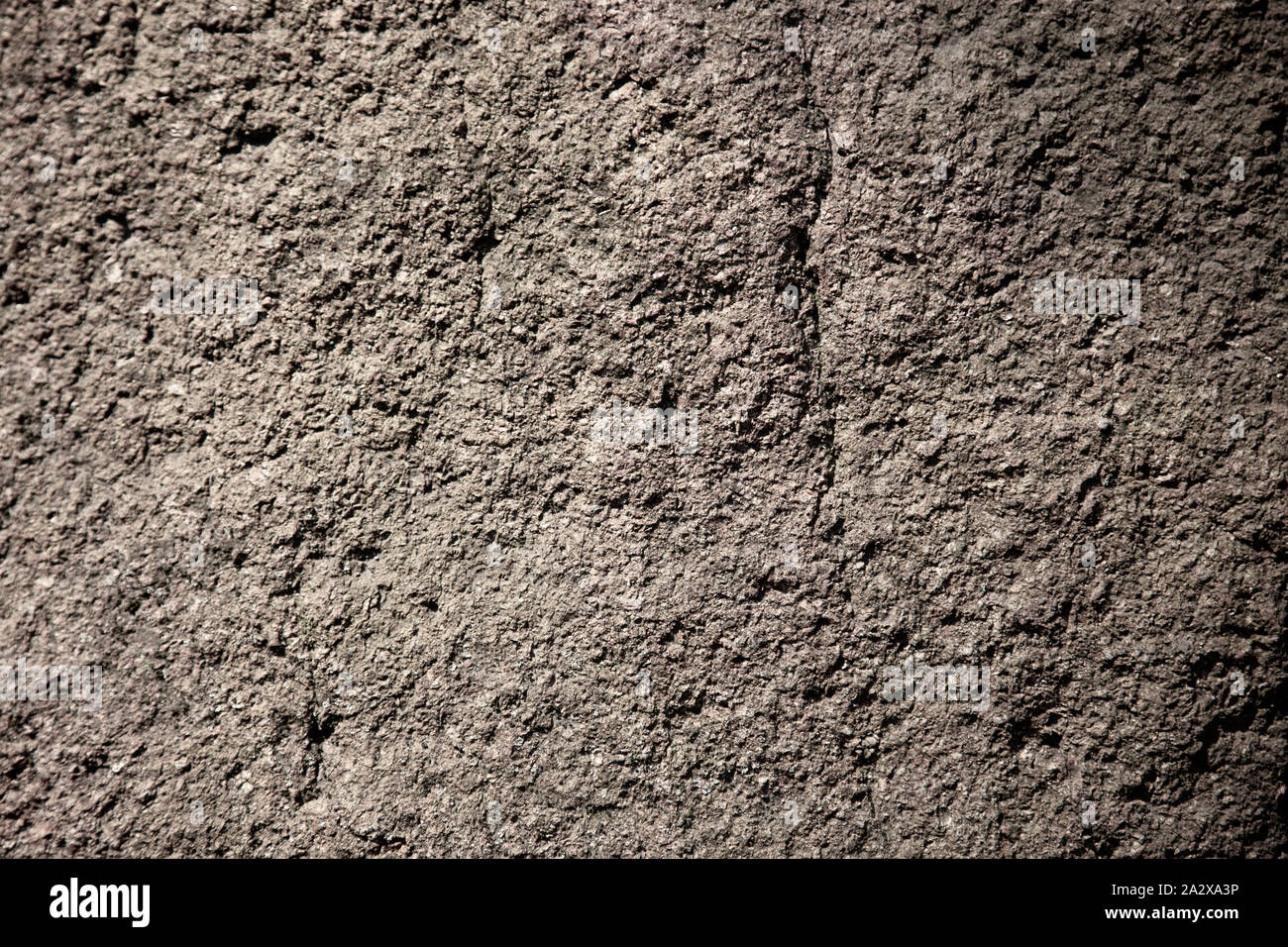 Scabrous gray natural stone or rock texture background Stock Photo - Alamy