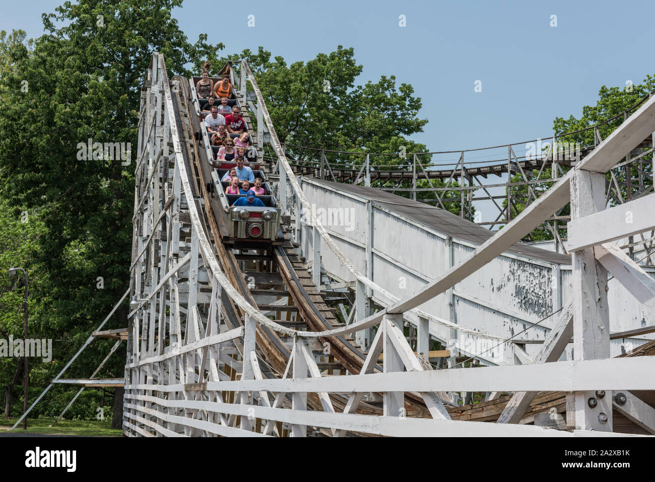 Riders enjoy (or endure) a spin on the Big Dipper roller-coaster at ...