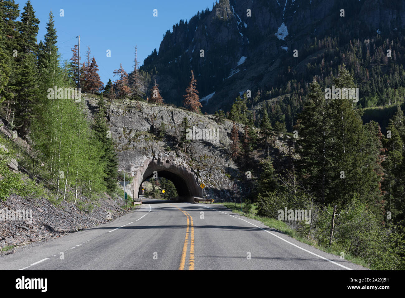 Rocky overpass and tunnel along the Million Dollar Highway below Ouray ...