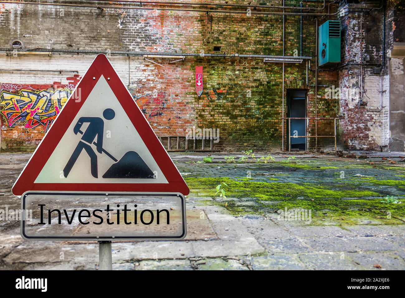 Investment factory sign Stock Photo - Alamy
