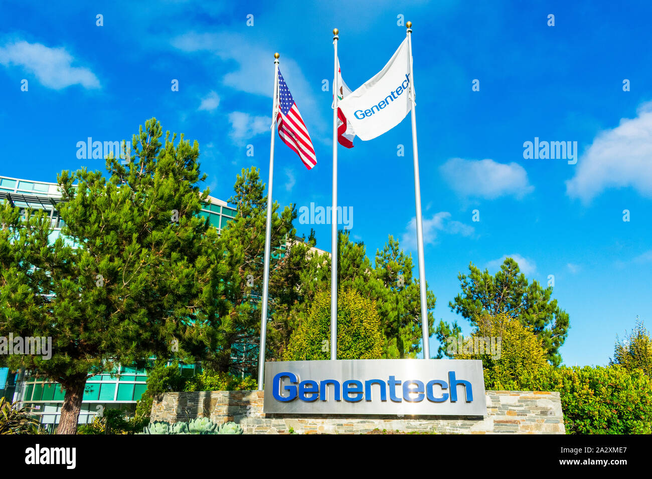 Genentech sign with Flag of the United States, Flag of California and ...