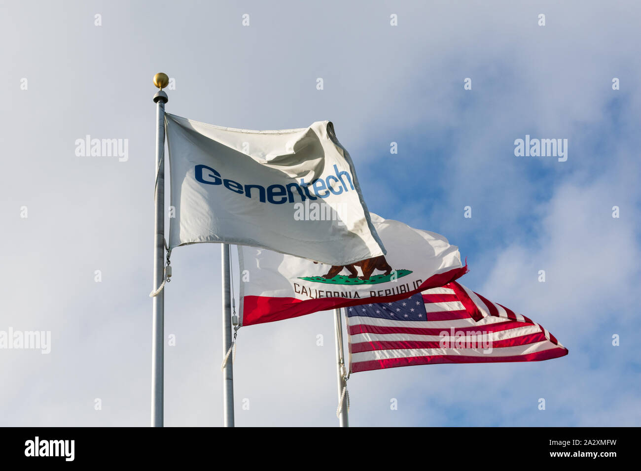 Genentech sign with Flag of the United States, Flag of California and ...