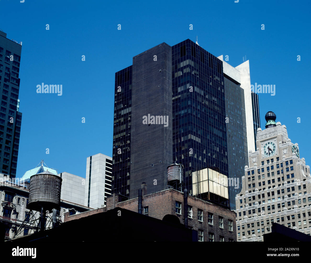 Rooftop view of a Manhattan block, showing an old water tower, New York ...