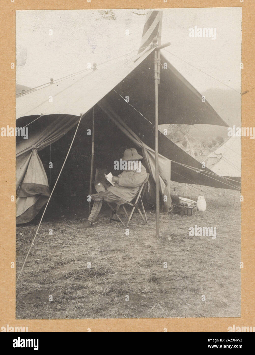 Roosevelt reading in front of his tent in hunting camp Stock Photo - Alamy