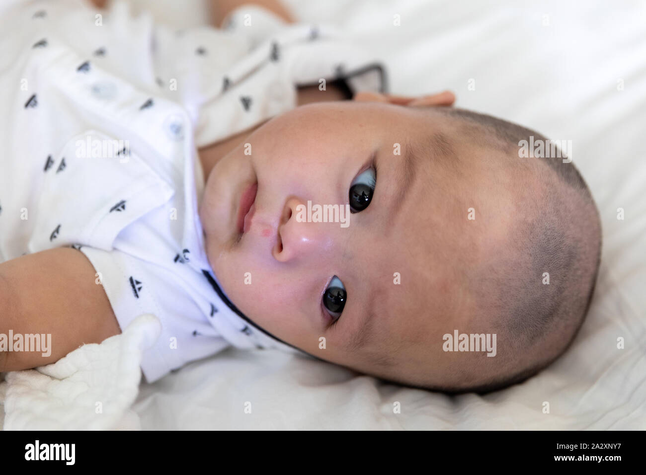 A happy round face baby hi-res stock photography and images - Alamy