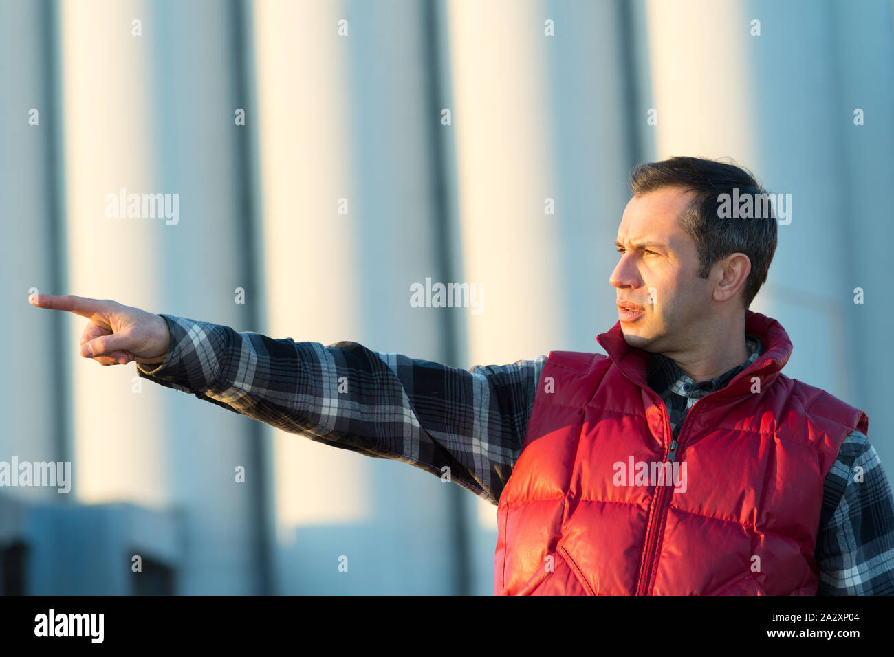 man pointing at an open space outside Stock Photo - Alamy