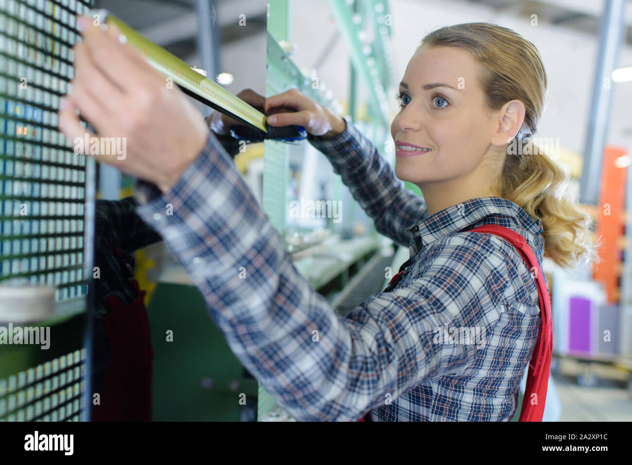 young woman measuring with tape Stock Photo - Alamy