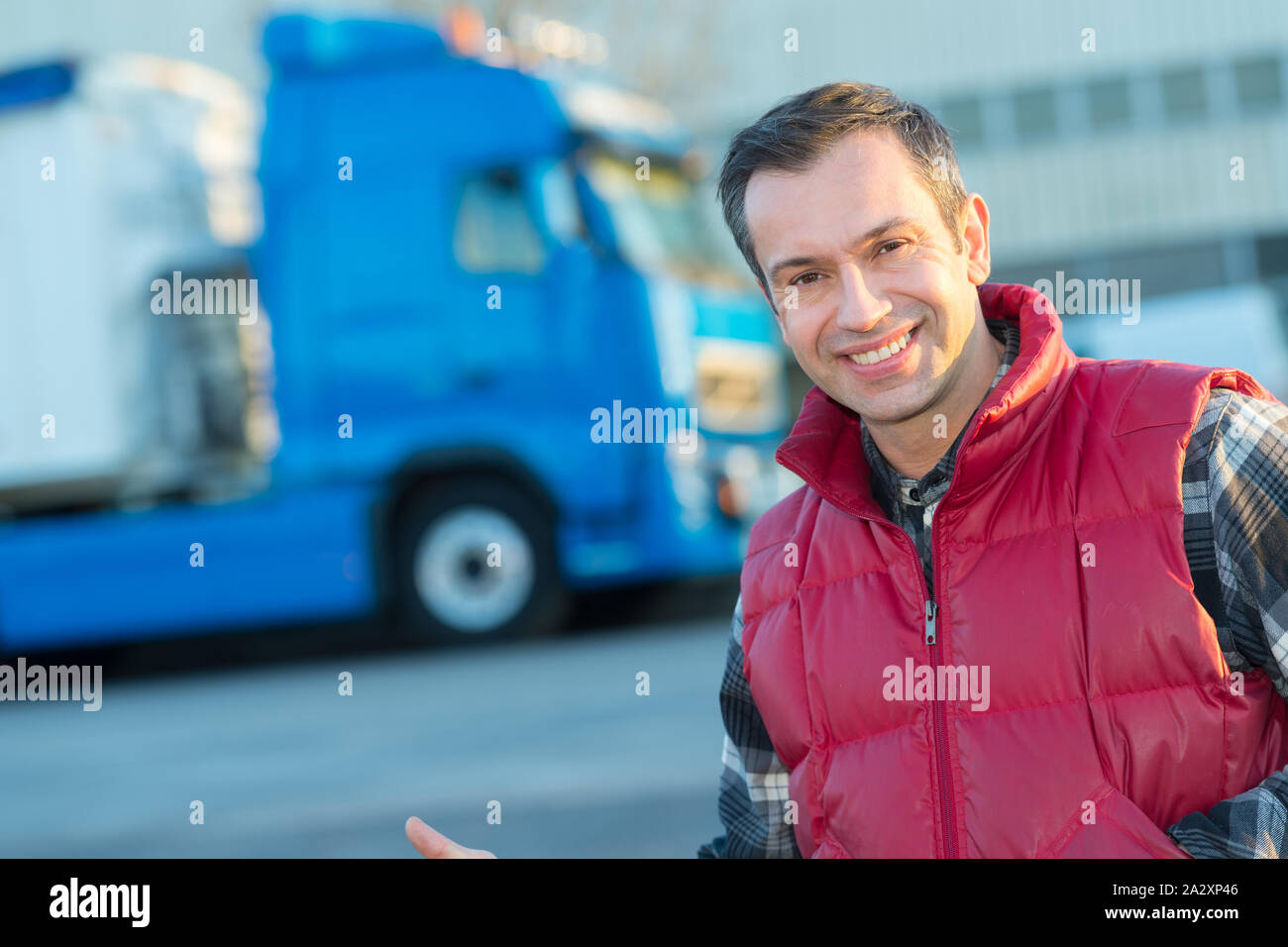 loading bay delivery worker smiling Stock Photo - Alamy