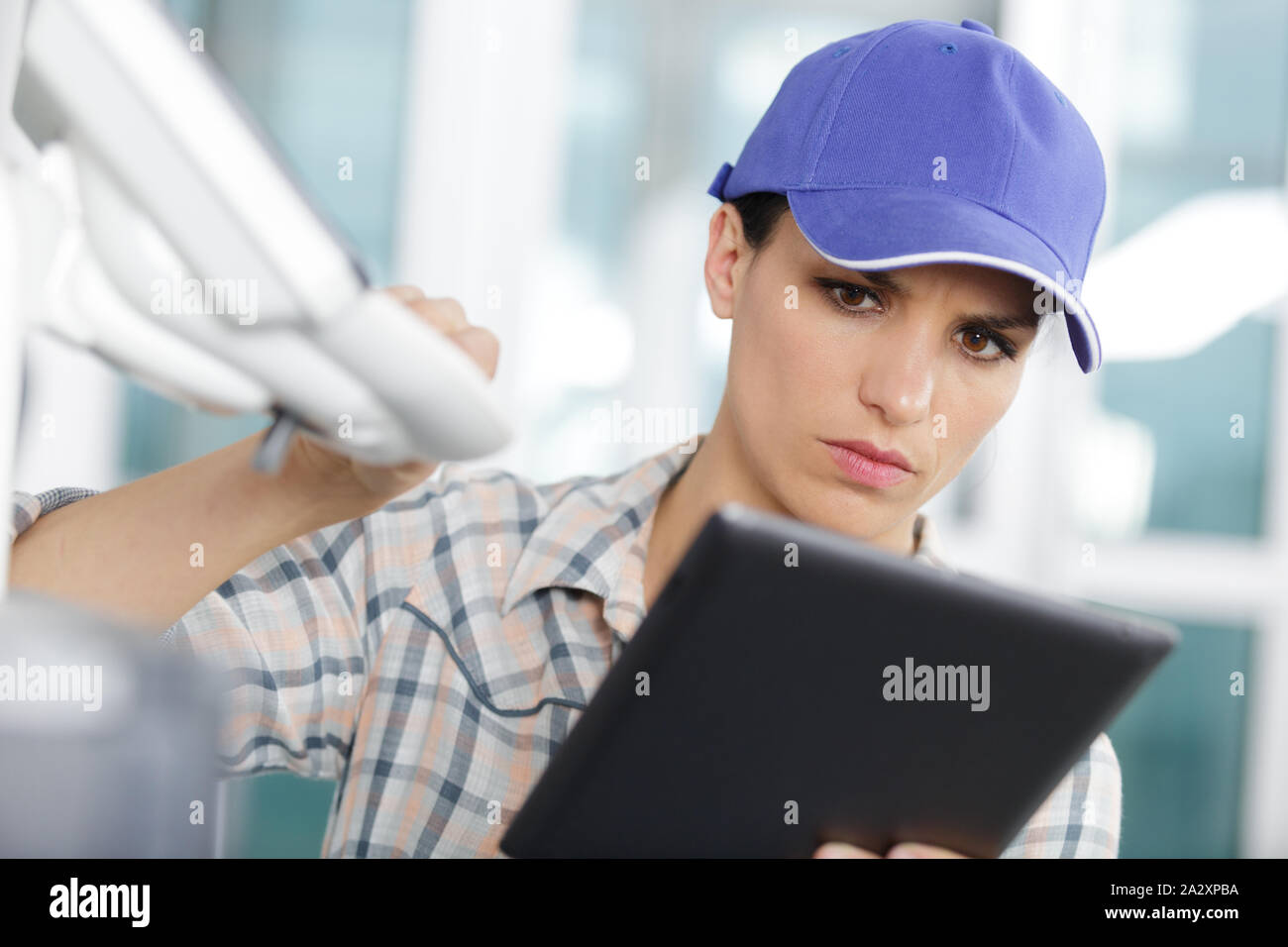 female technician using tablet control Stock Photo - Alamy