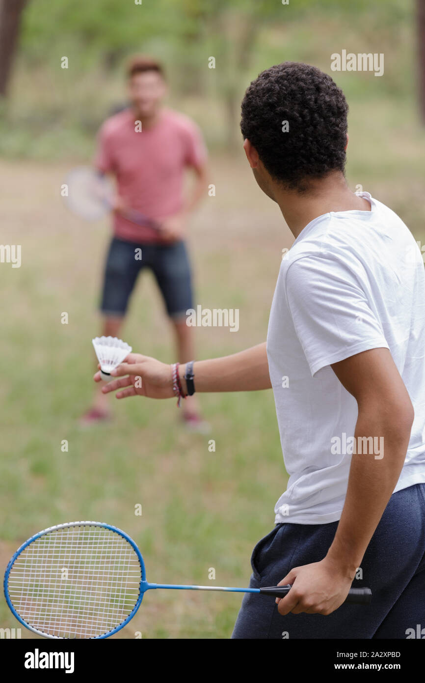 two men playing badminton outdoors Stock Photo - Alamy