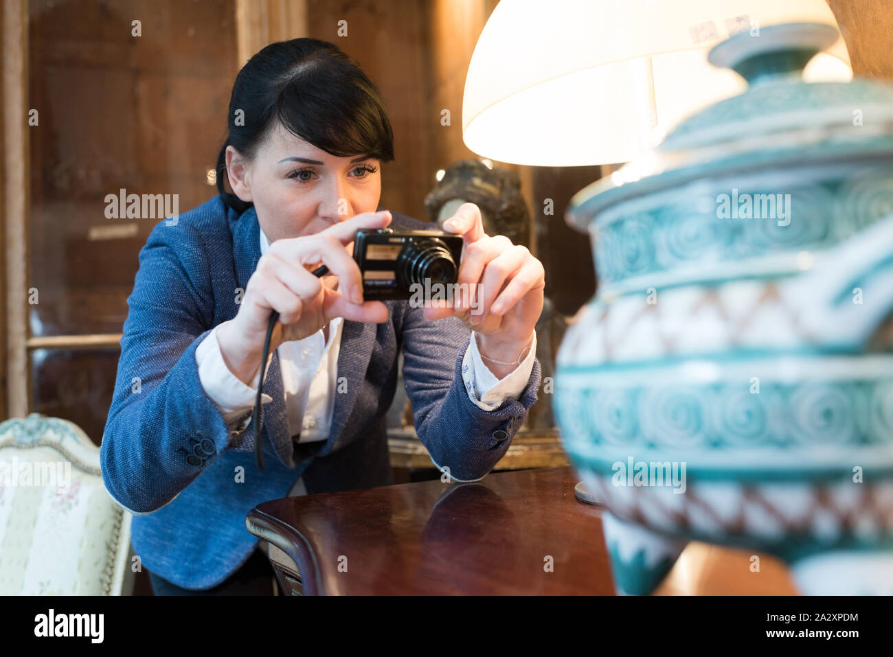 woman talking a picture in a museum Stock Photo - Alamy