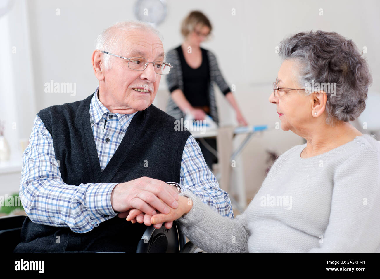 Hands wheelchair carer hi-res stock photography and images - Alamy