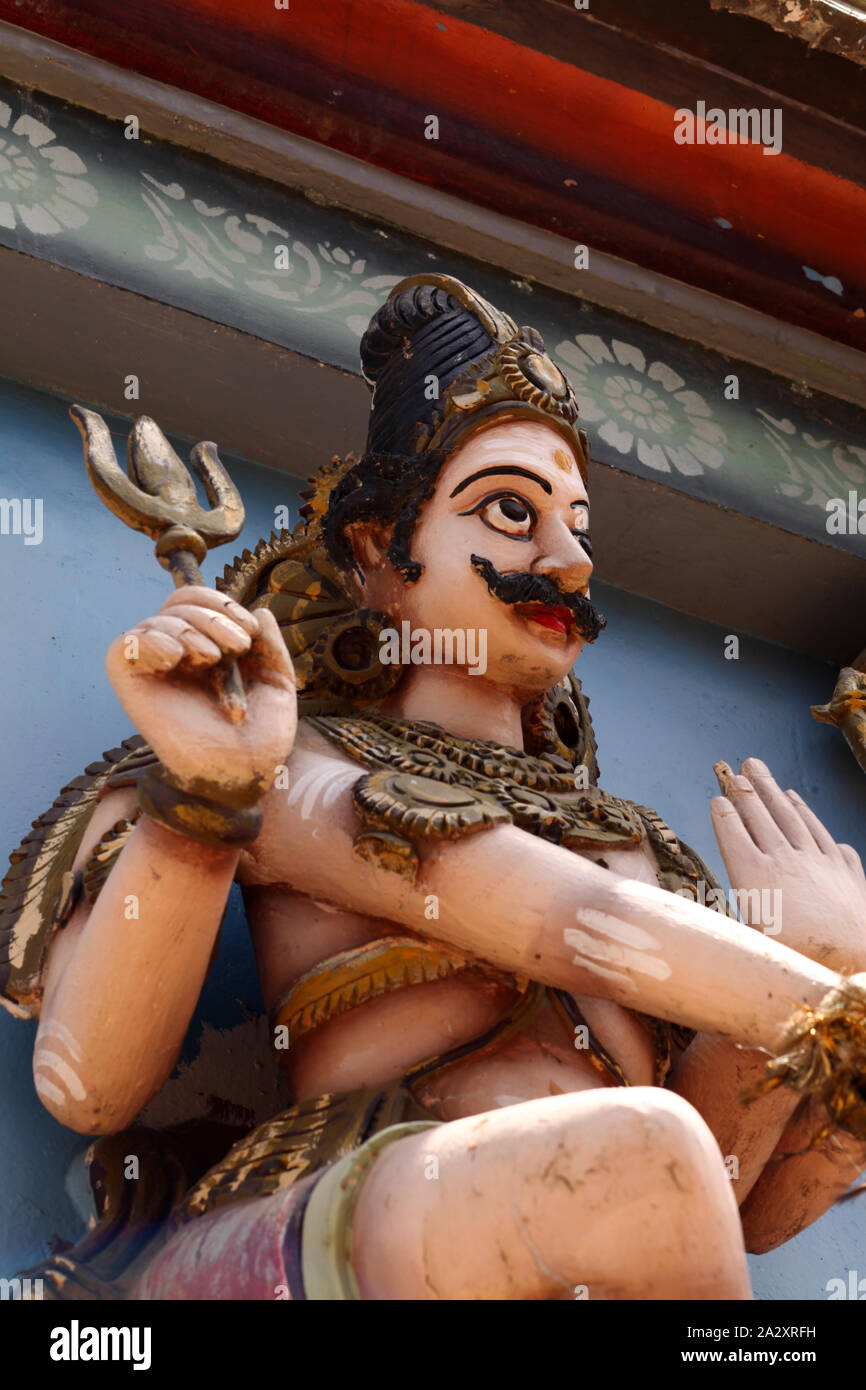Hindu God Statue with carvings on it Stock Photo - Alamy