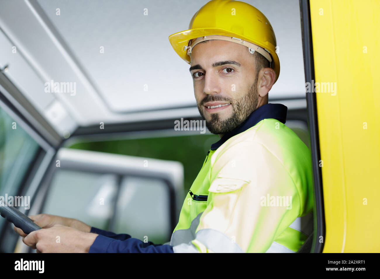 construction worker inside a lorry Stock Photo - Alamy