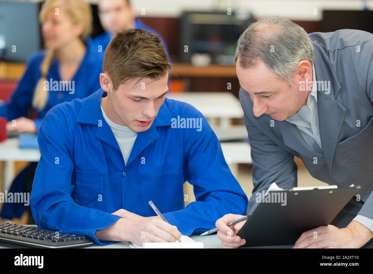 factory manager and apprentice engineer Stock Photo - Alamy