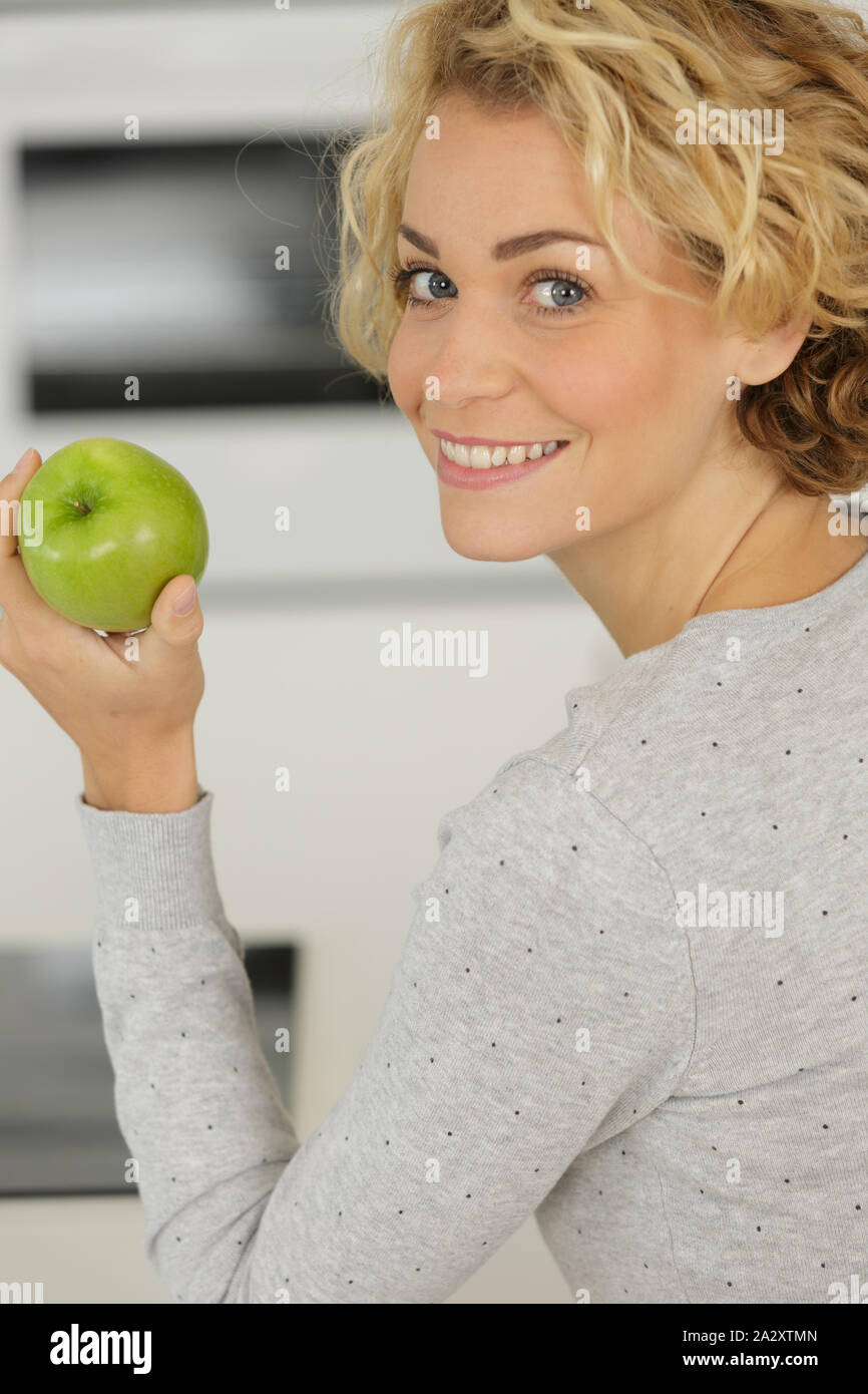 woman eating green apple closeup isolated on white background Stock ...