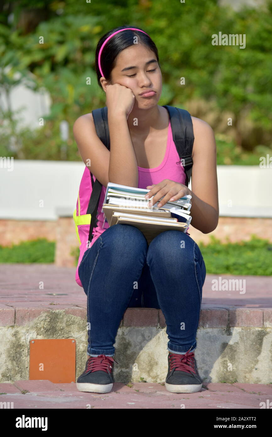 School Girl And Boredom With Books Stock Photo - Alamy