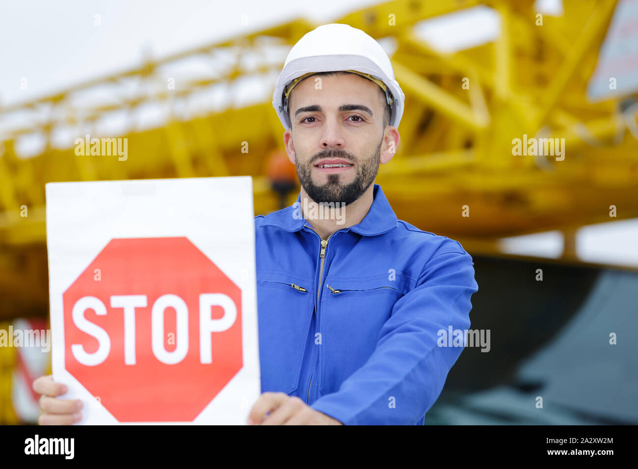 Workman holding stop sign High Resolution Stock Photography and Images ...