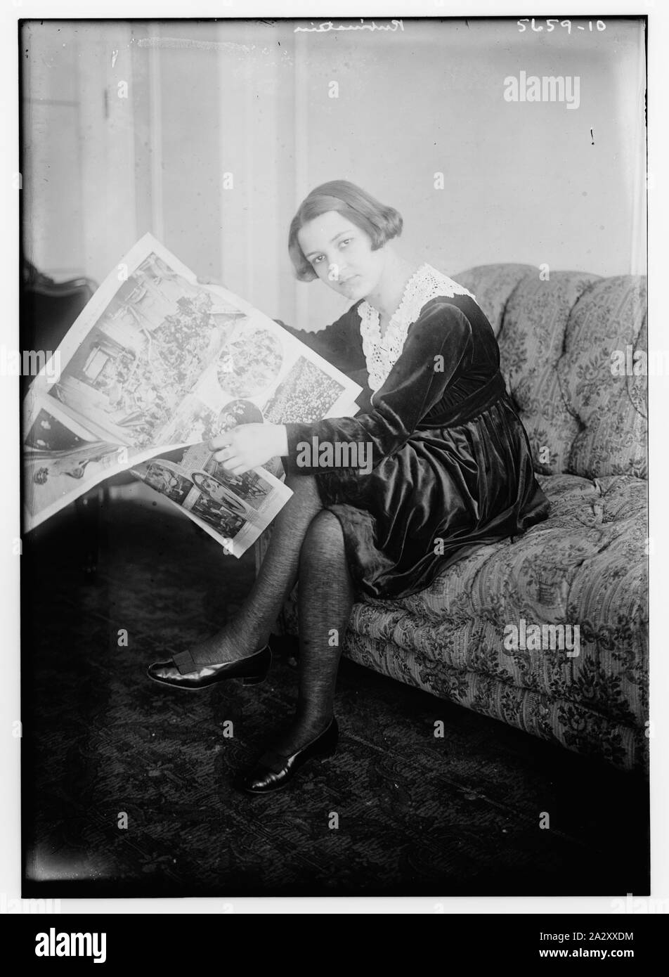 Seated on couch Black and White Stock Photos & Images - Alamy