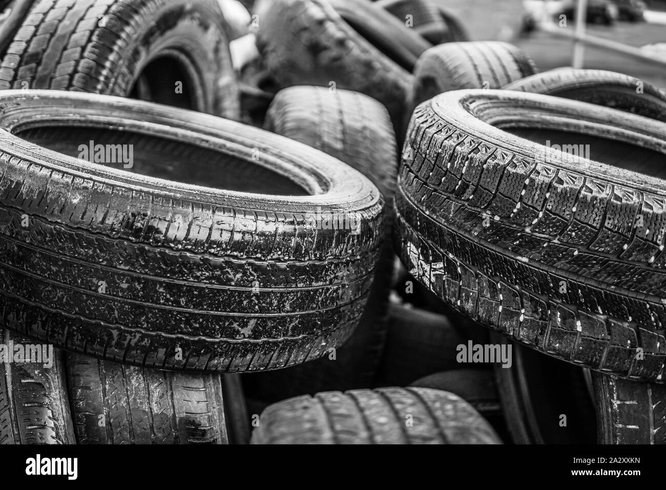 Stack pile of used car tires for recycling Stock Photo - Alamy