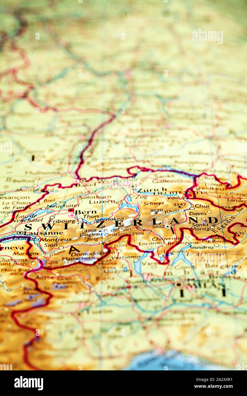 Switzerland on atlas world map Stock Photo - Alamy
