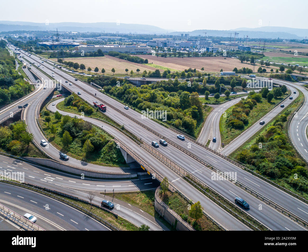 Aerial view of a highway intersection with a clover-leaf interchange in ...