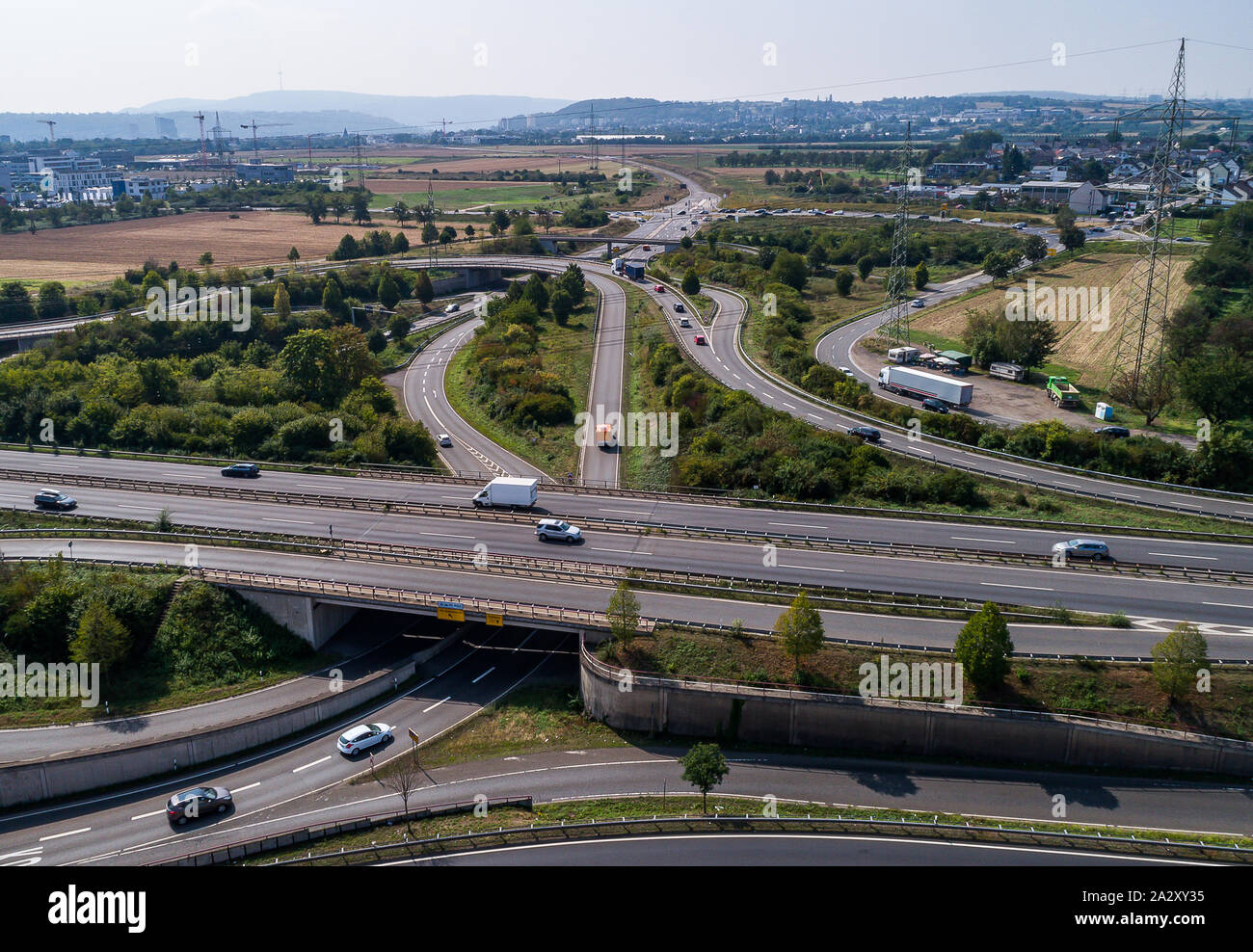Aerial view of a highway intersection with a clover-leaf interchange in ...