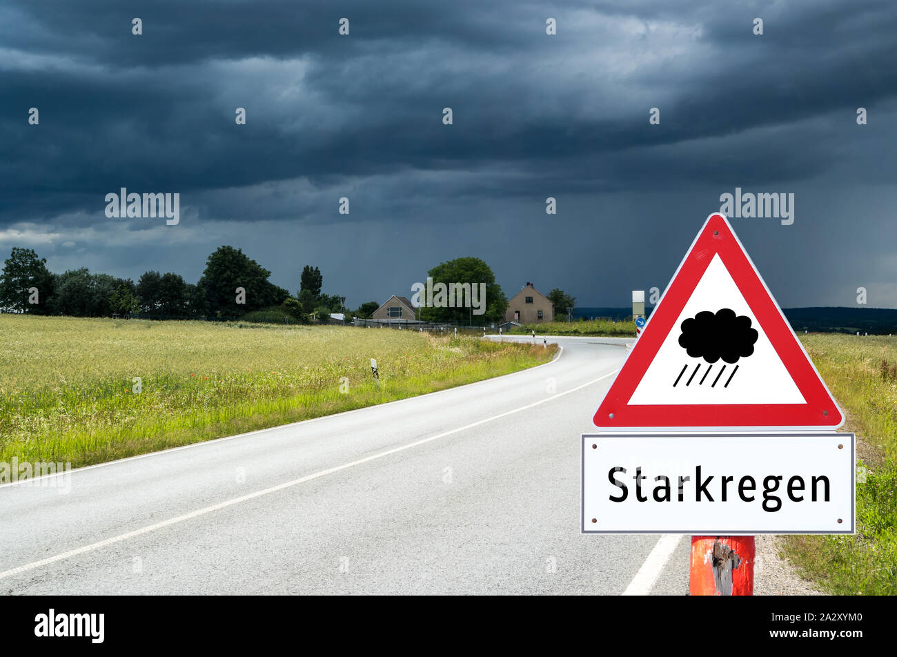 Attention heavy rain sign Stock Photo - Alamy