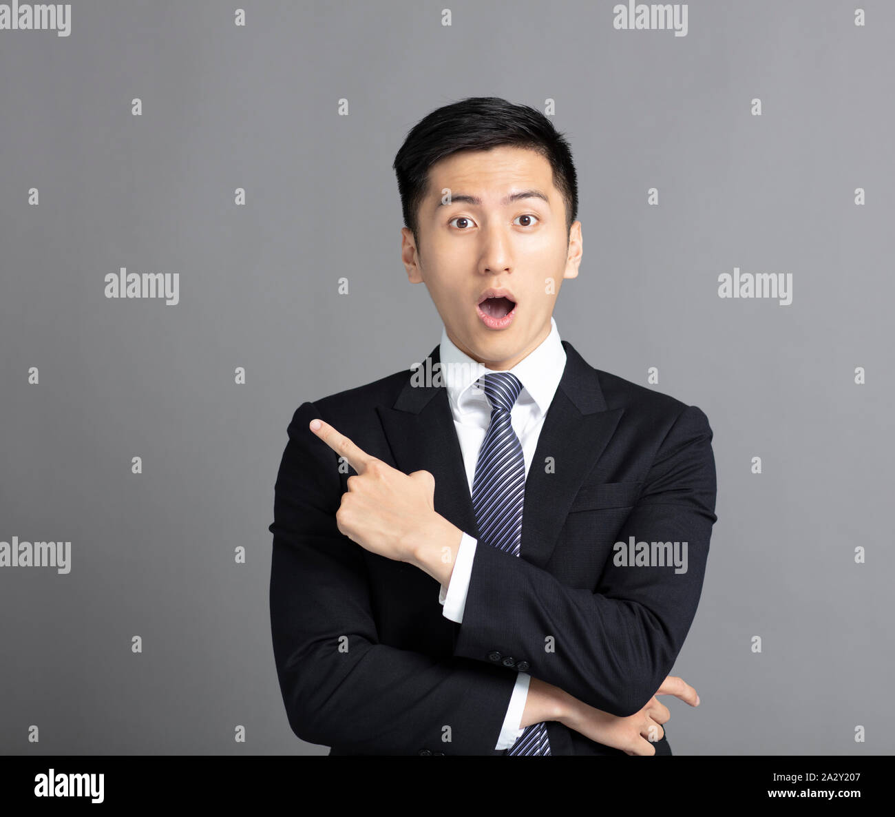 Portrait of surprised successful young business man Stock Photo - Alamy