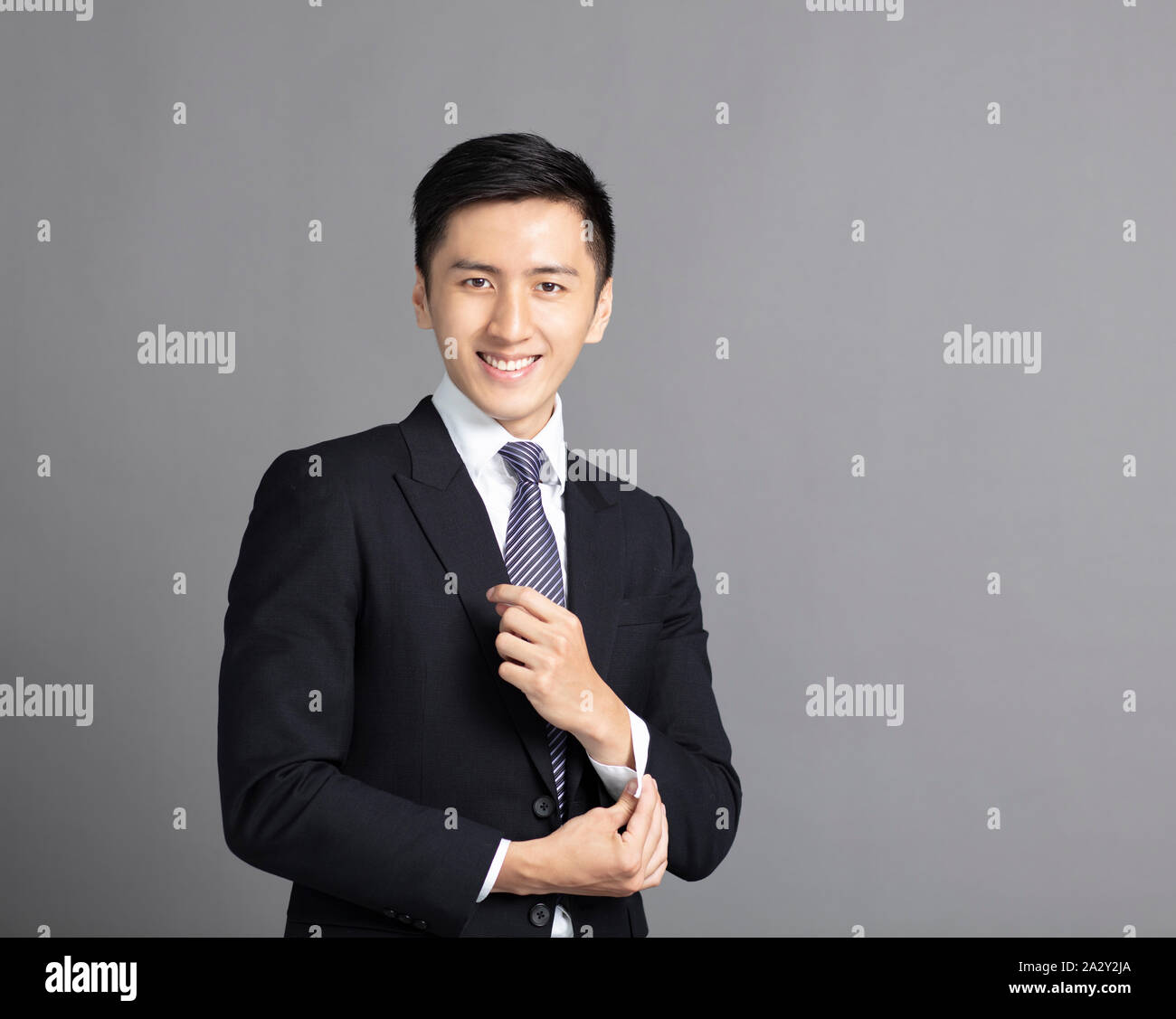 Portrait of charming successful young business man Stock Photo - Alamy