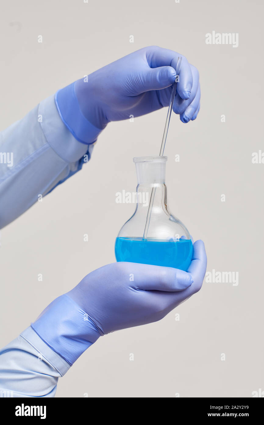 Hand holding chemical flask isolated hi-res stock photography and ...