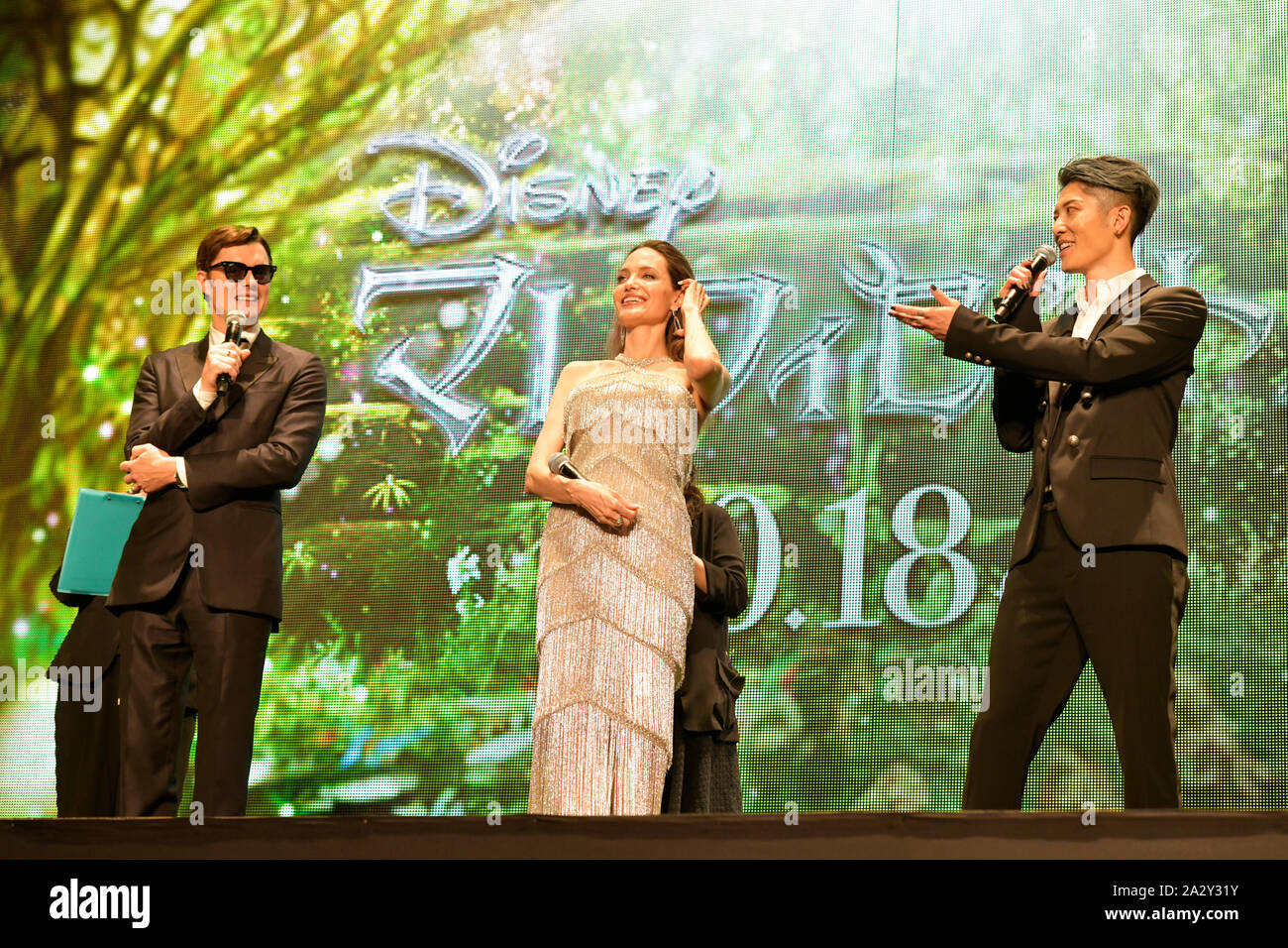 (L-R) Actors Sam Riley, Angelina Jolie and Japanese musician MIYAVI ...
