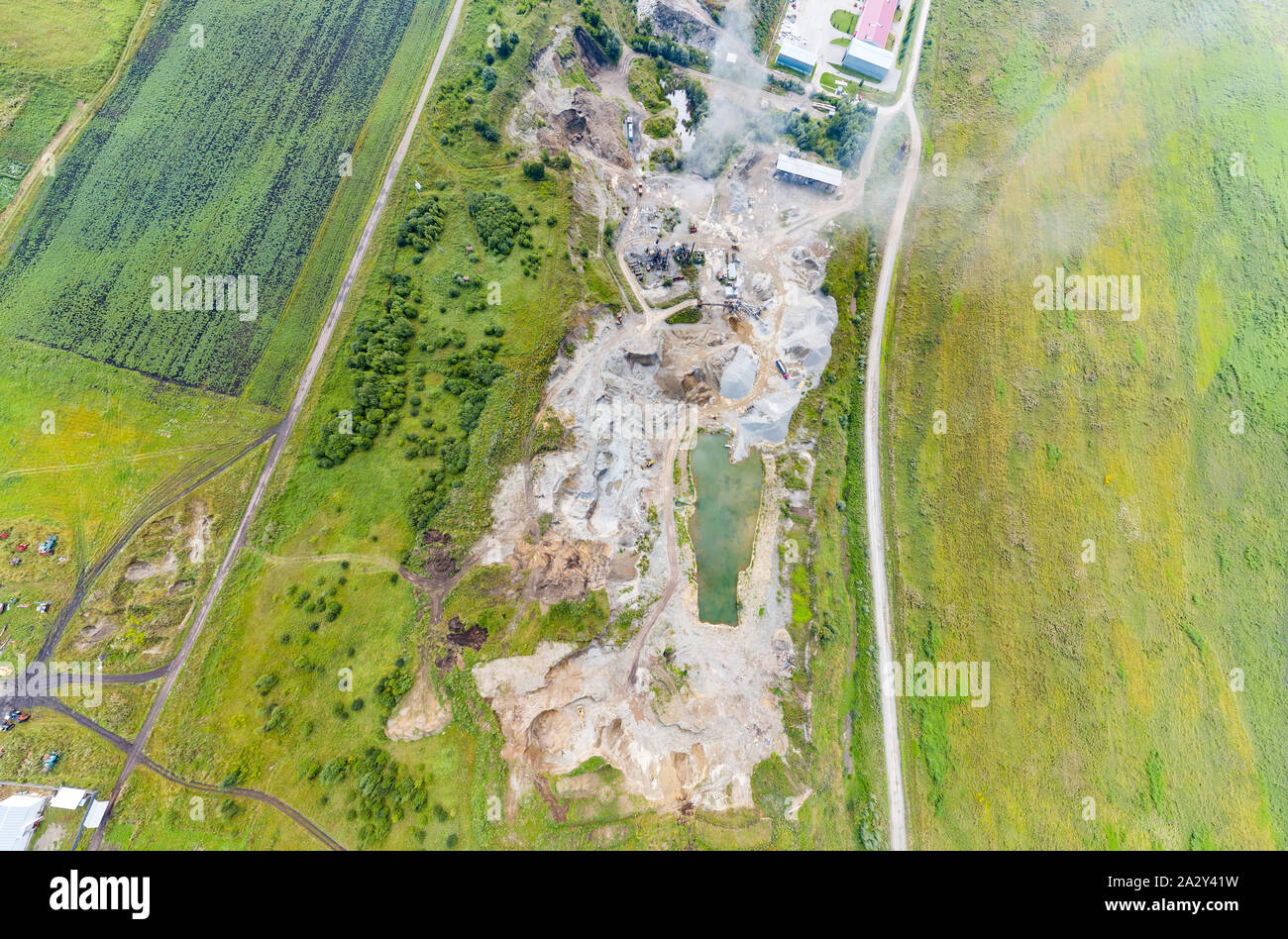 Aerial view of a small plant for the production and cleaning rubble and ...