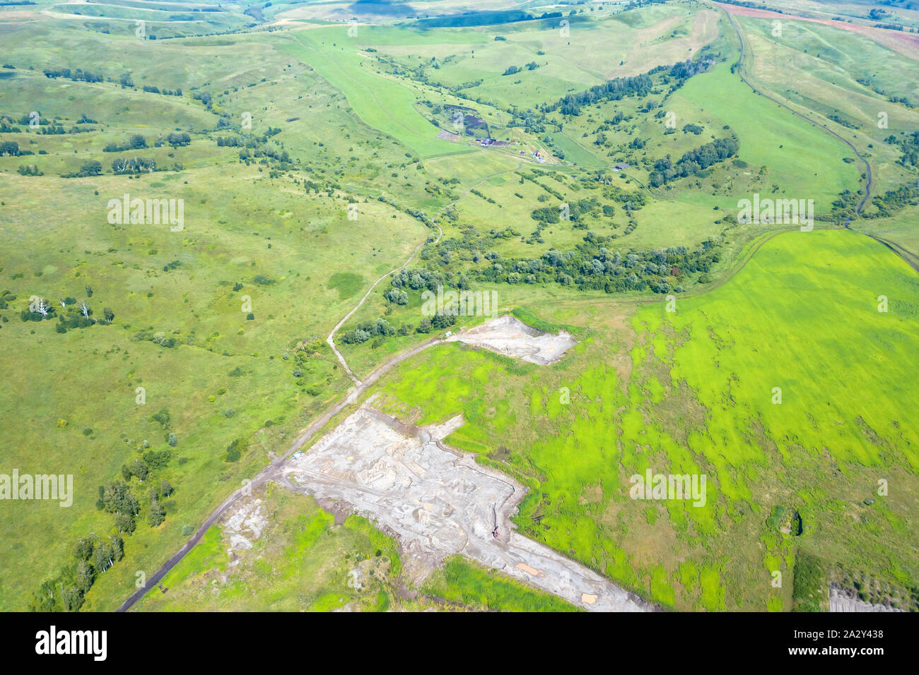 landscape of the ridge covered with green trees and view a valley ...