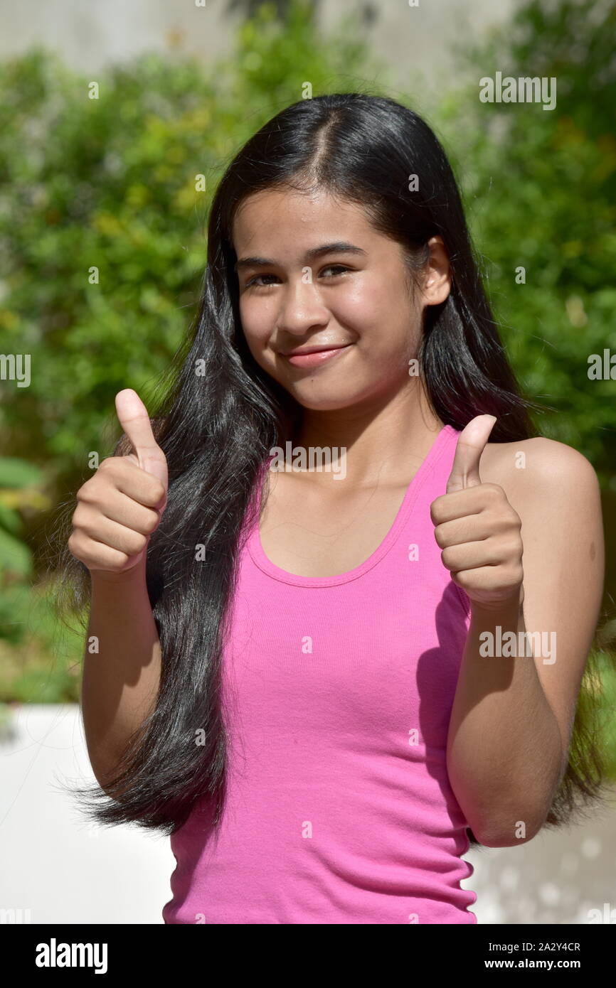 A Youthful Juvenile With Thumbs Up Stock Photo - Alamy