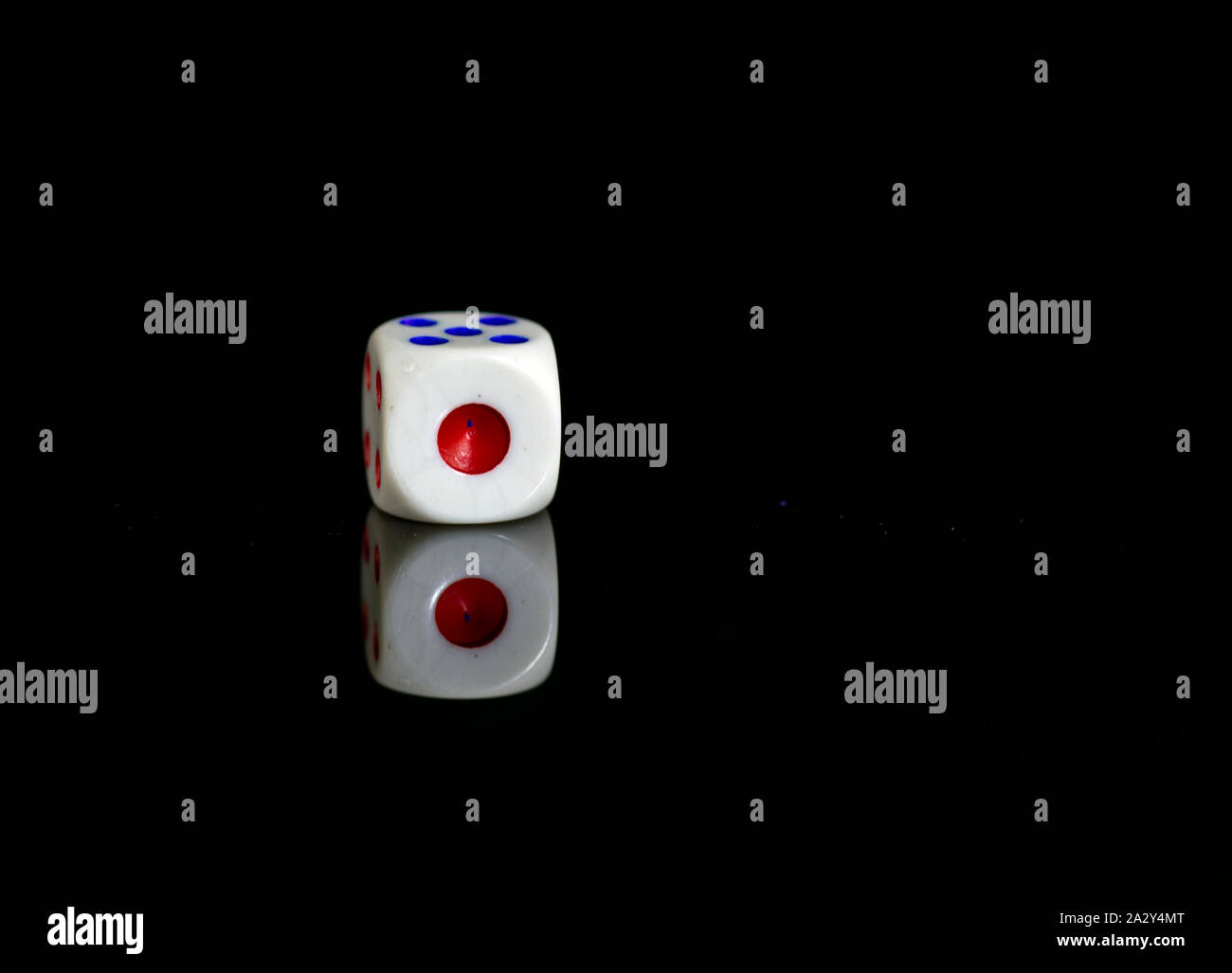 Dice spinning on black surface hi-res stock photography and images - Alamy