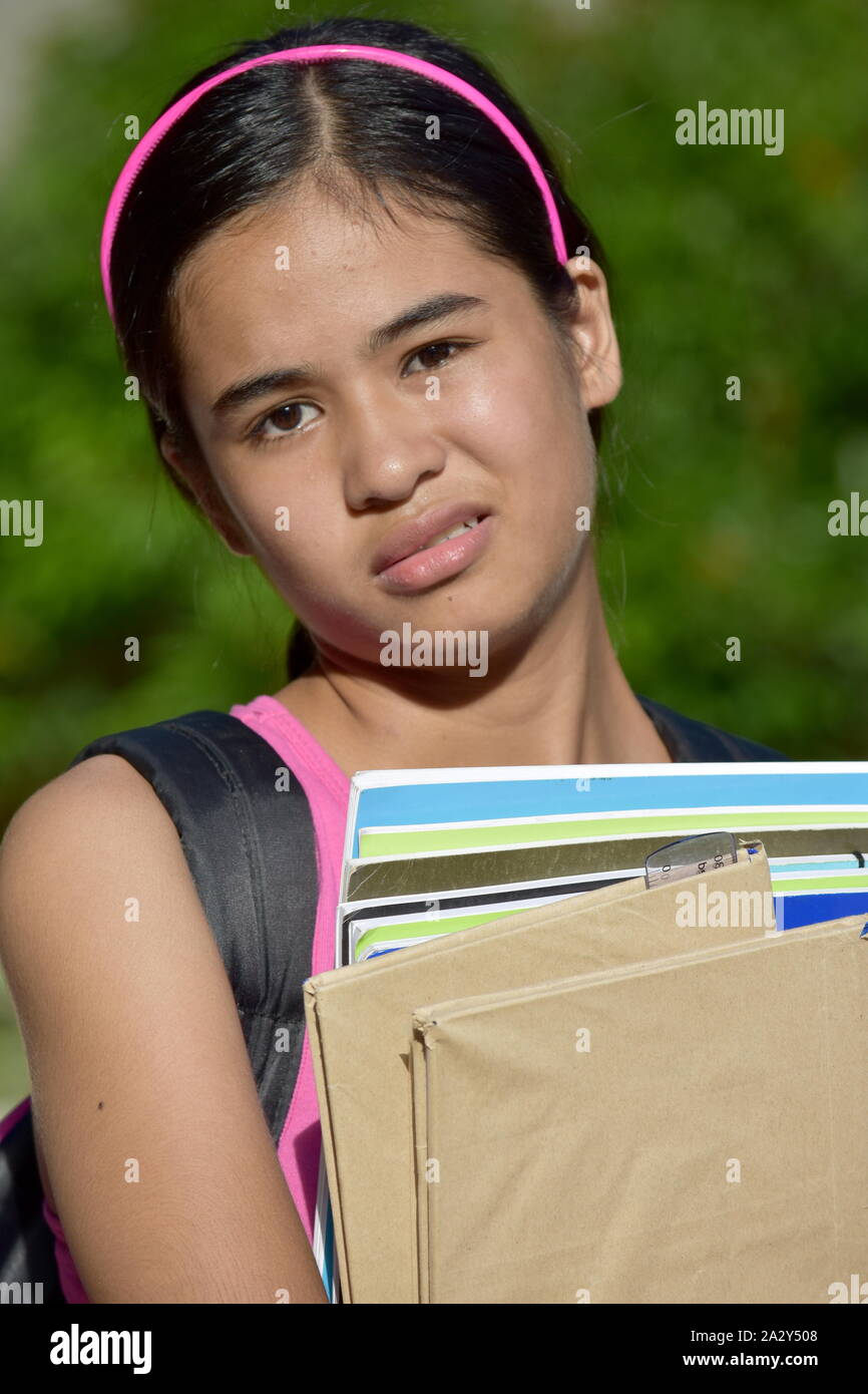 Confused Pretty Girl Student With Textbooks Stock Photo - Alamy