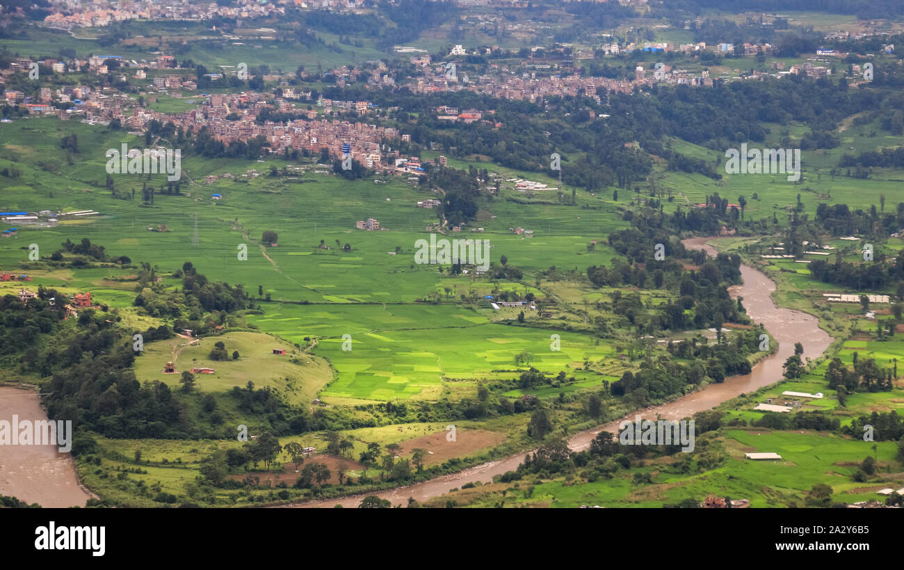 Aerial view of a river flowing through fields Stock Photo - Alamy