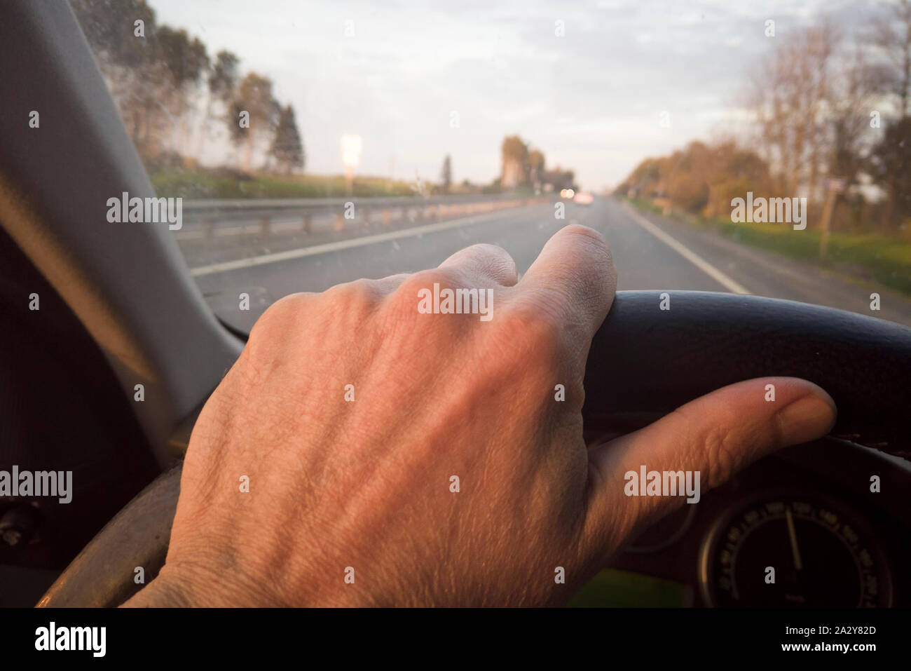 Gripping steering wheel hi-res stock photography and images - Alamy