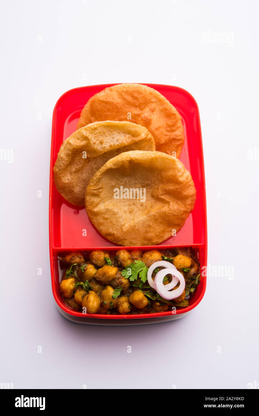 Punjabi Chole / Choley masala with puri or poori in lunch box or tiffin ...