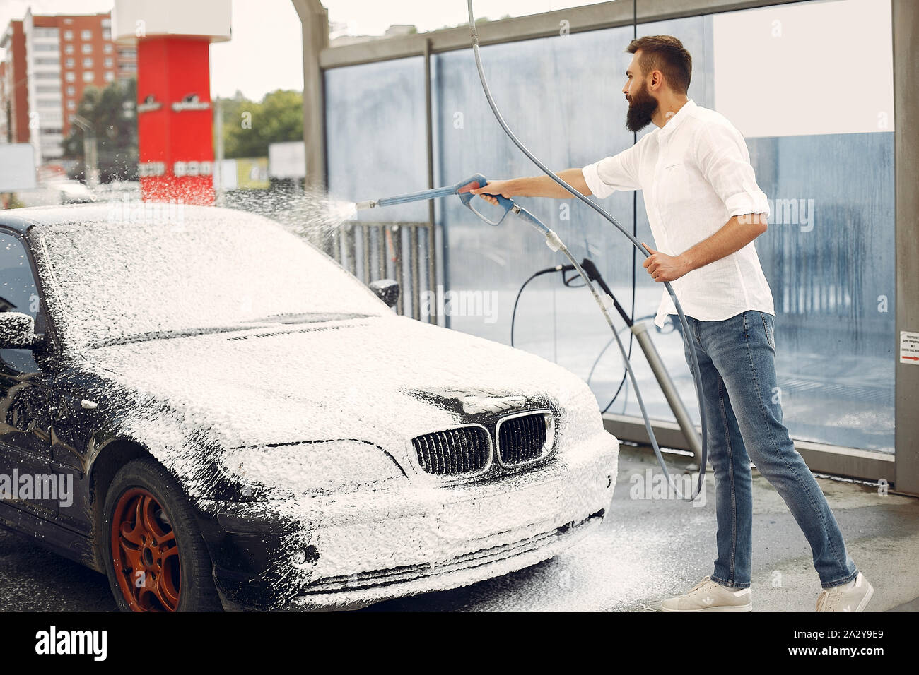 Guy washing car wash hi-res stock photography and images - Alamy